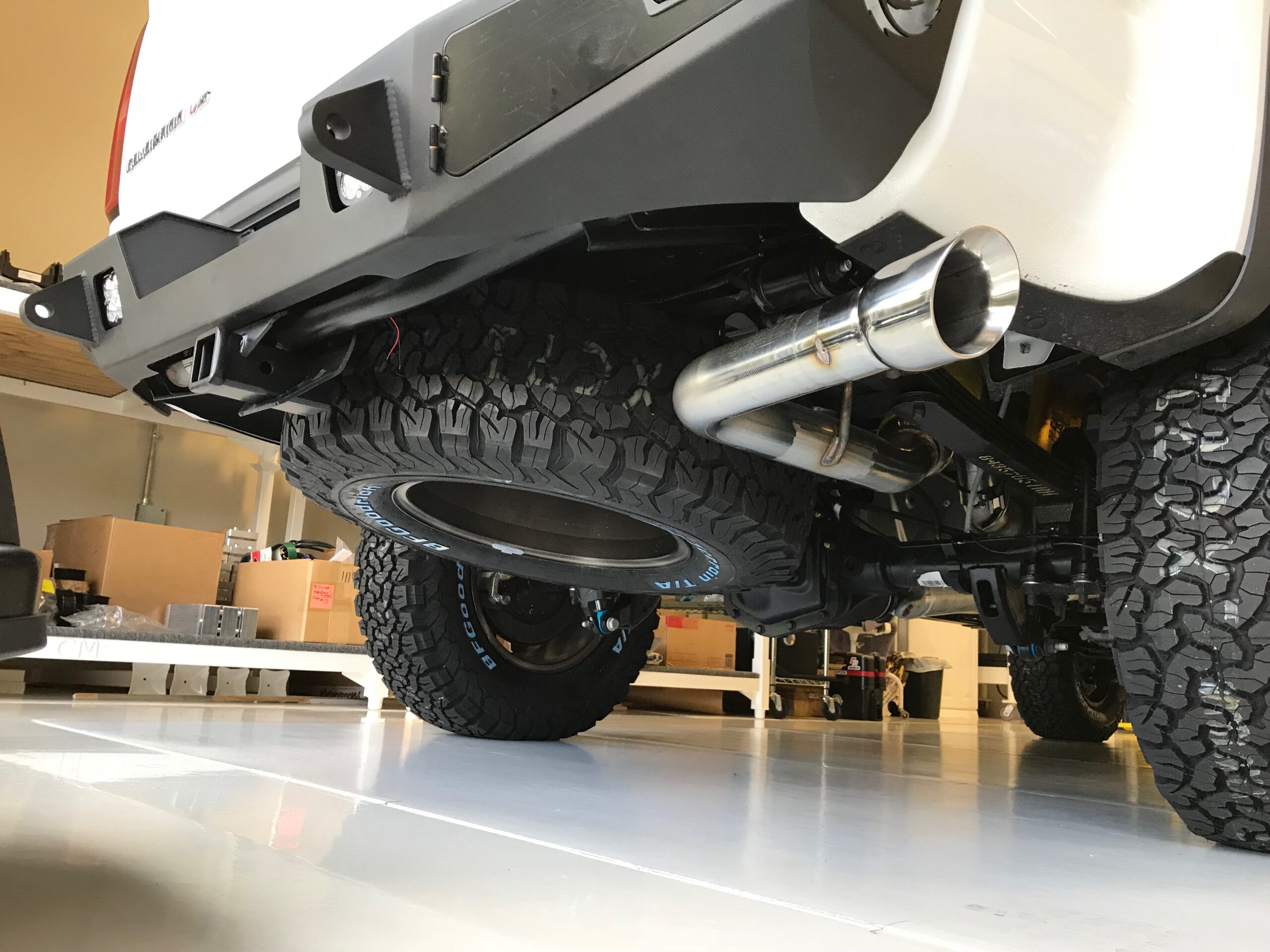 white truck custom tail pipe spare tire – Mallett Performance Cars